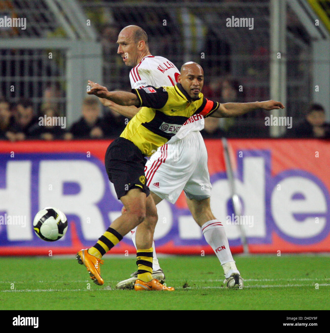 Nuremberg striker Jan Koller (back) and Dortmund's Dede (front) vie for ...