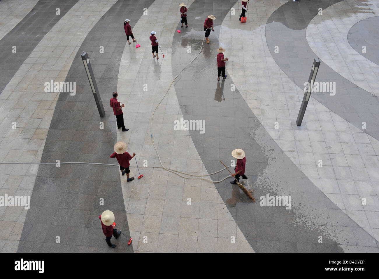 street washers washing the floor Stock Photo - Alamy