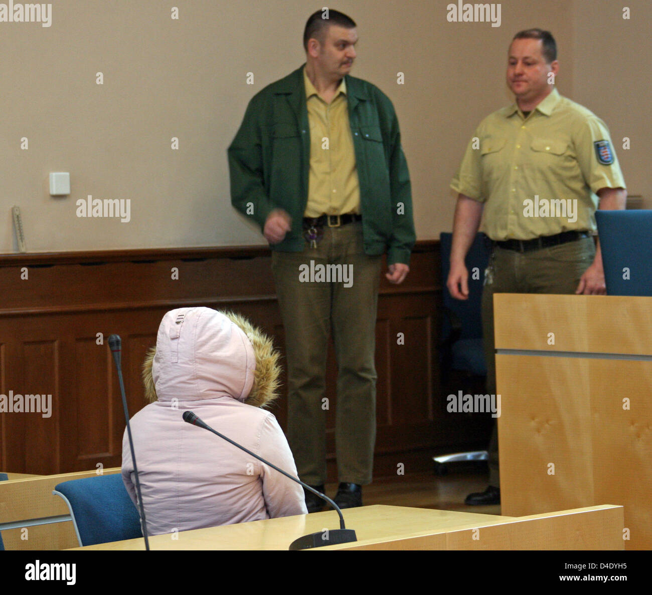 The defendant (L) waits for the beginning of the homicide trial at the ...