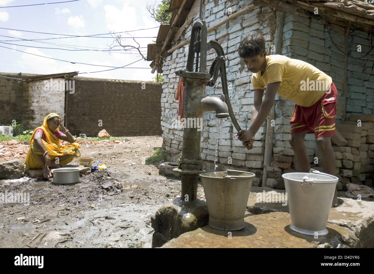 Man pumps water from water hi-res stock photography and images - Alamy