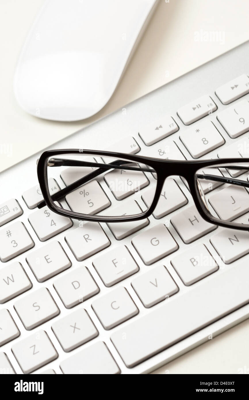 Glasses, keyboard and mouse Stock Photo - Alamy