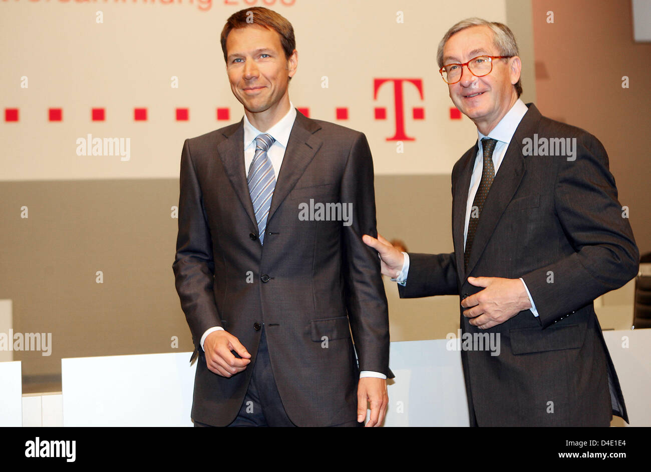 CEO of Deutsche Telekom, Rene Obermann (L), and chairman of the ...