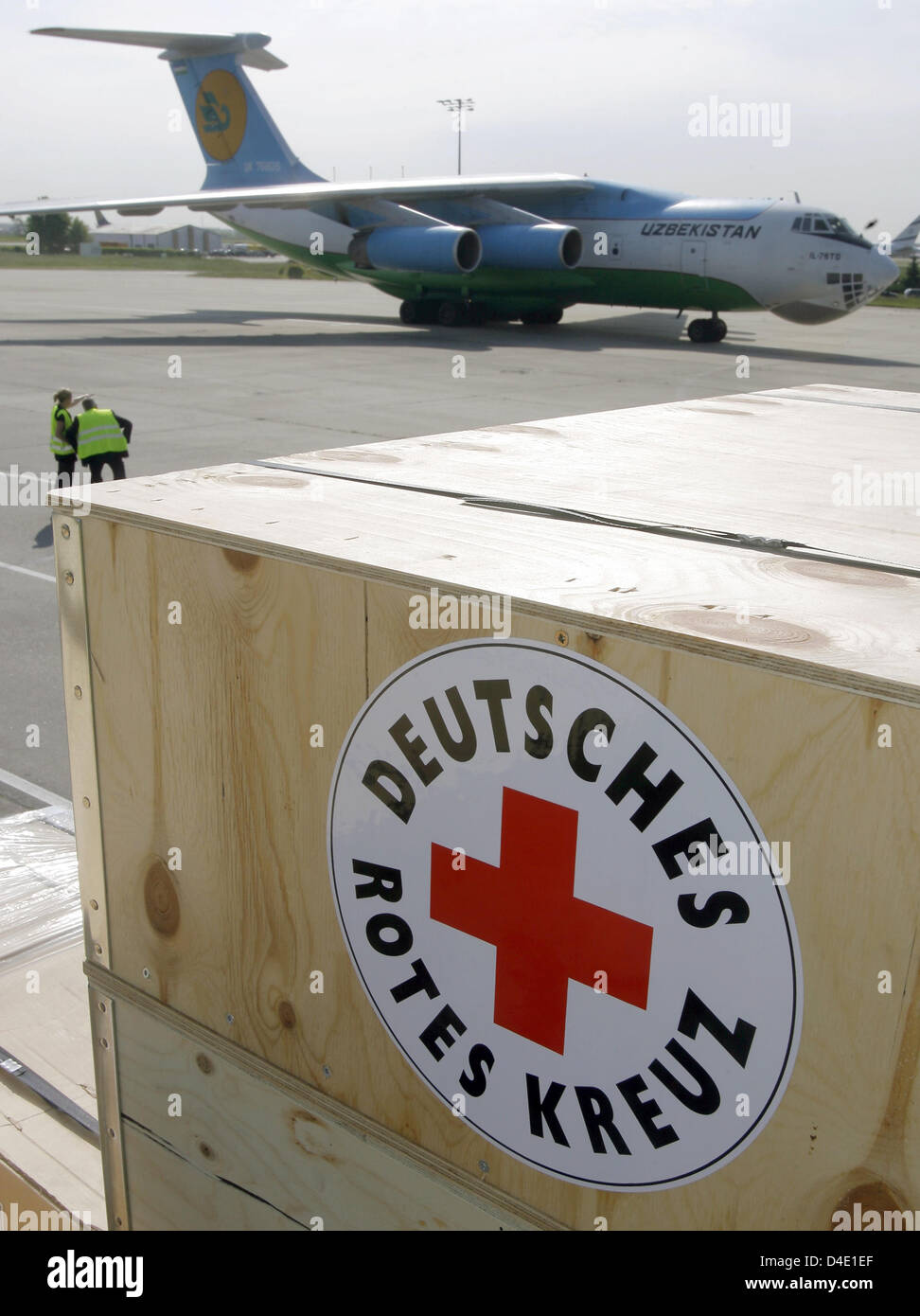 Boxes with the logo of the German Red Cross (DRK) are pictured in front ...