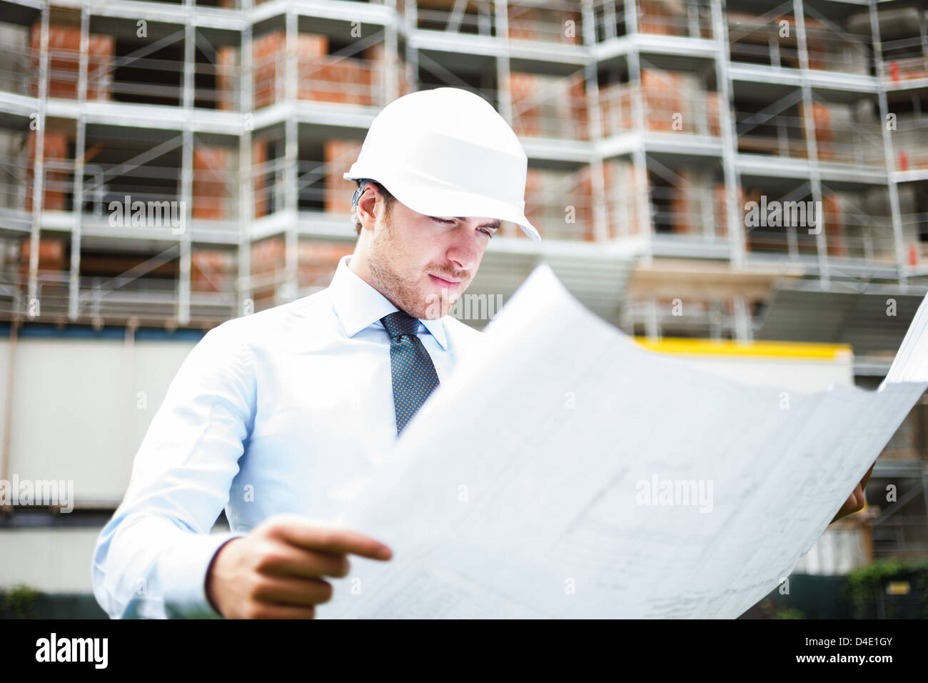 Architect at work in a construction site Stock Photo - Alamy