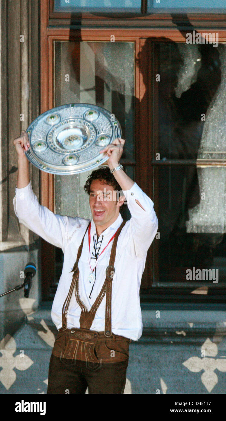 Bayern Munich's Luca Toni celebrates with the championship trophy on ...