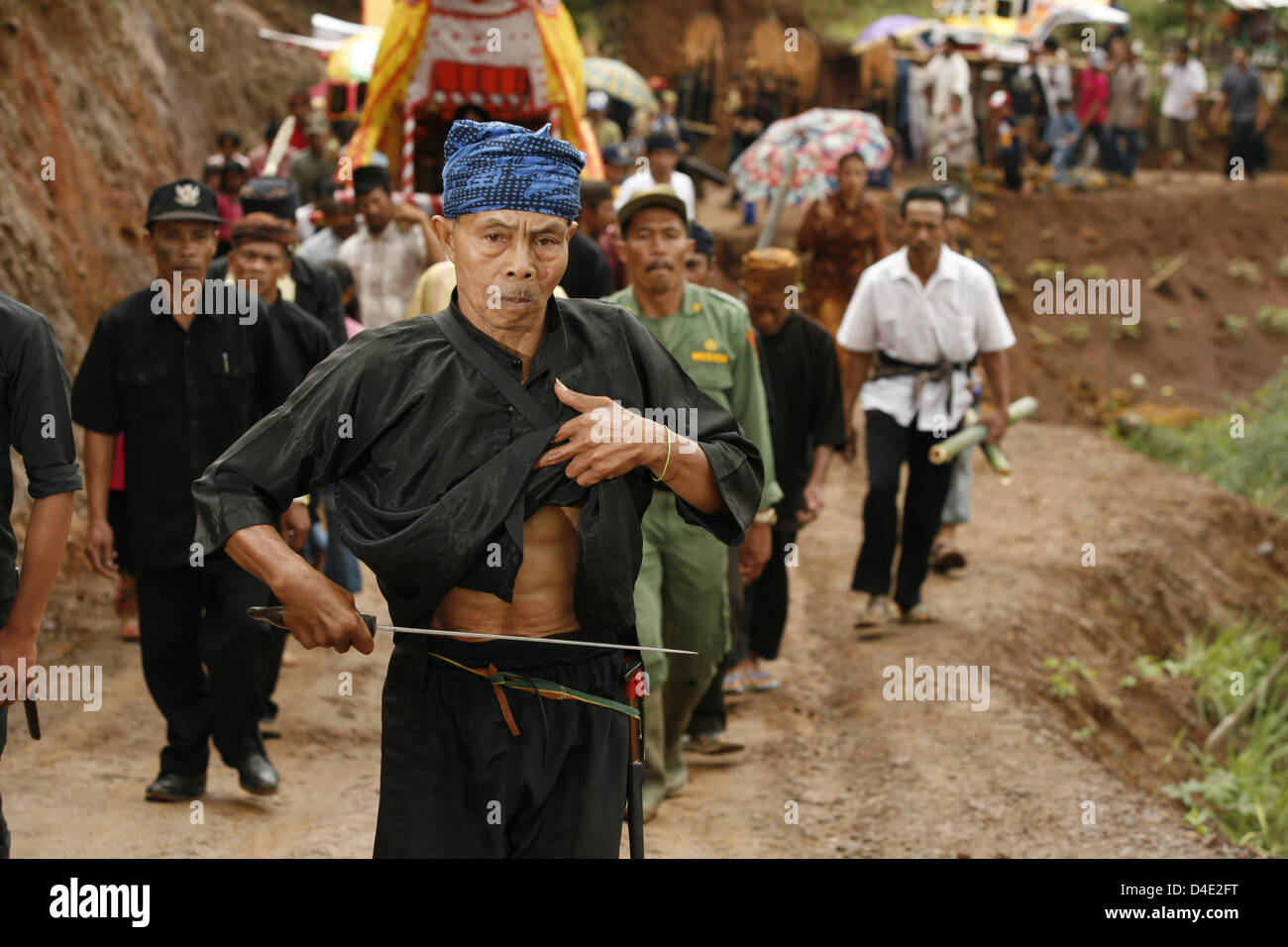 A Debus Player (L) and his young scholars lead a ceremony in Ciptagelar ...