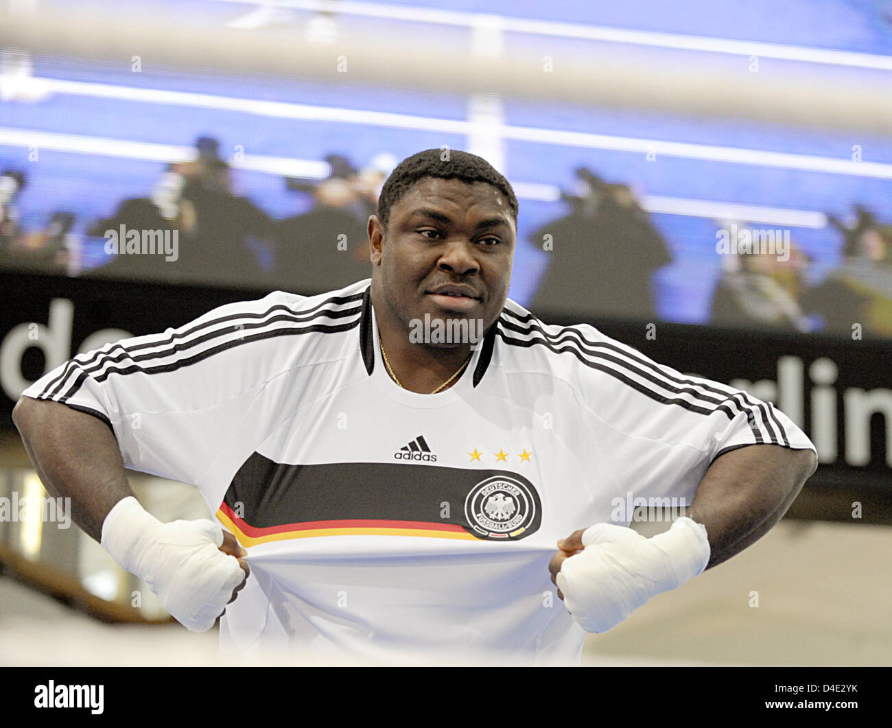 Heavy weight boxer Samuel Peter poses in a jersey of the German ...