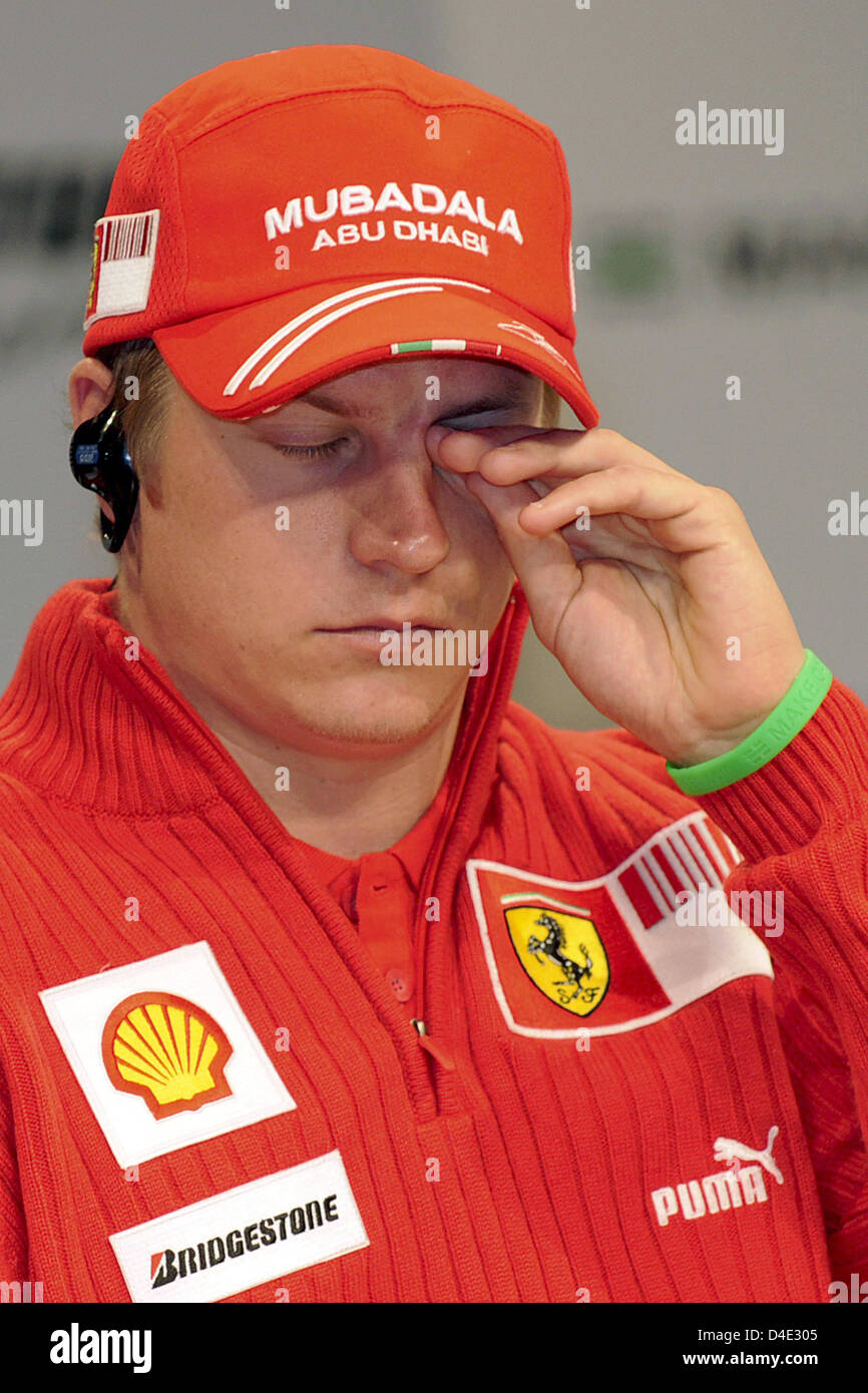 Finnish Formula One driver Kimi Raikkonen of Ferrari gestures during ...