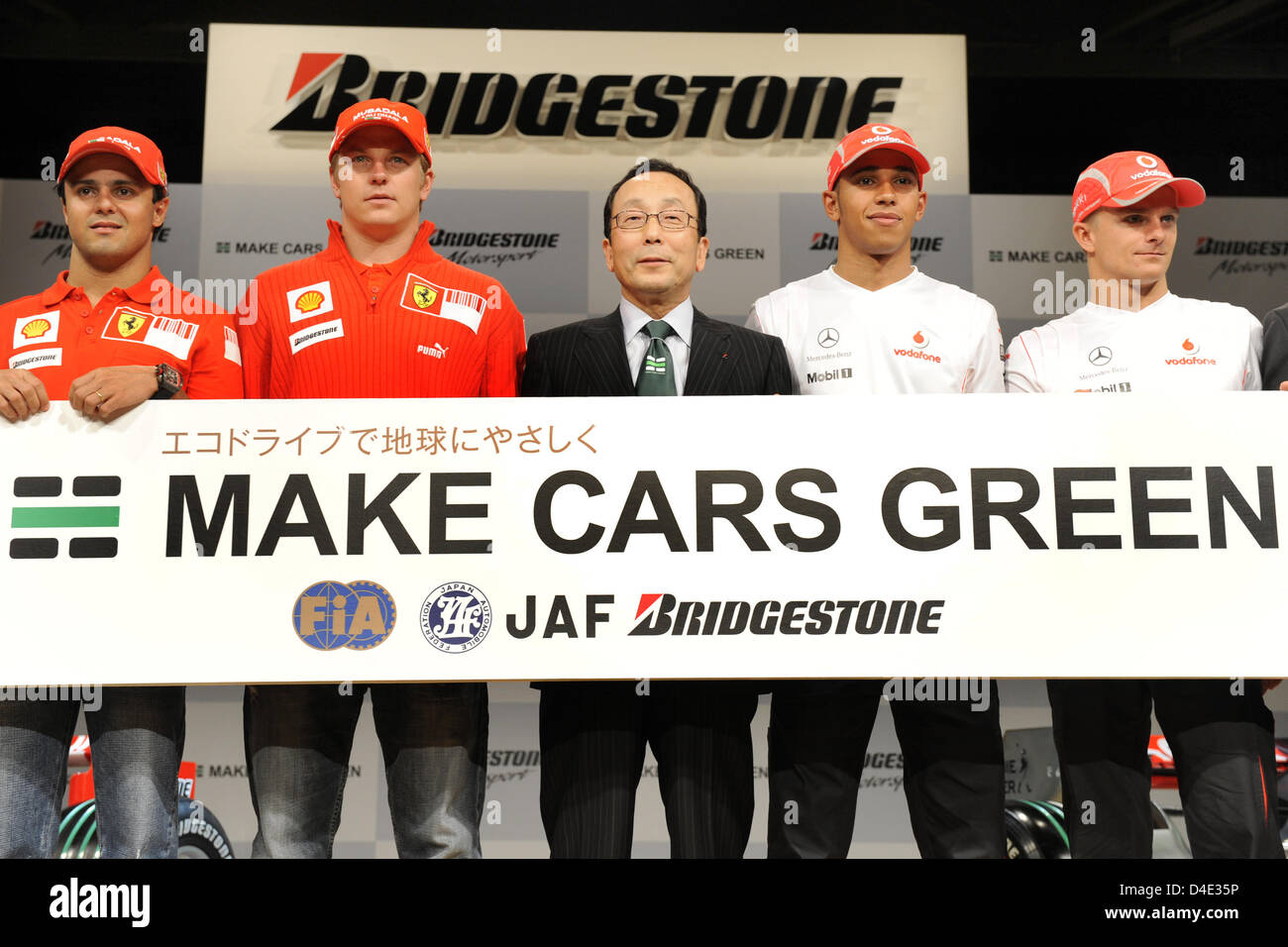 CEO of Bridgestone Shoshi Arakawa (C) poses with (L-R) Formula One ...