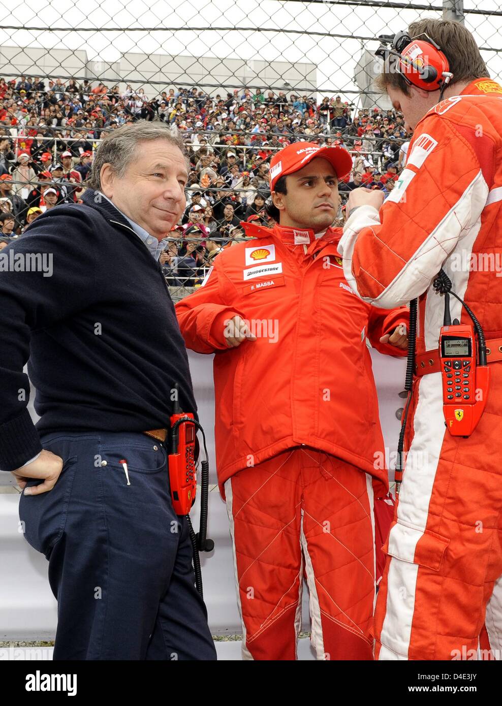 Brazilian Formula One driver Felipe Massa (C) and CEO of Ferrari French ...