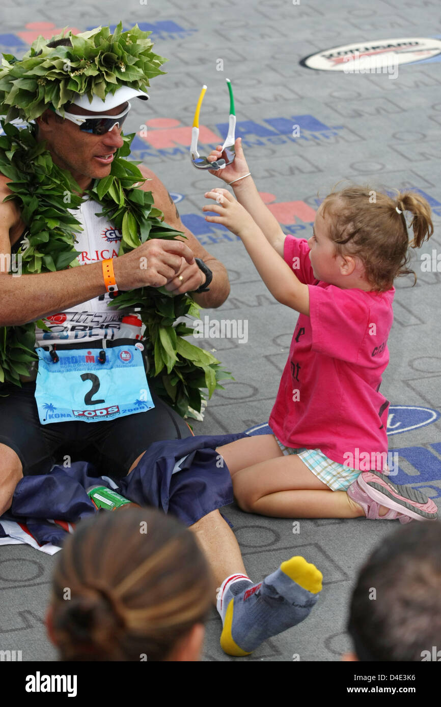 Australian Craig Alexander is pictured with his daughter after winning ...