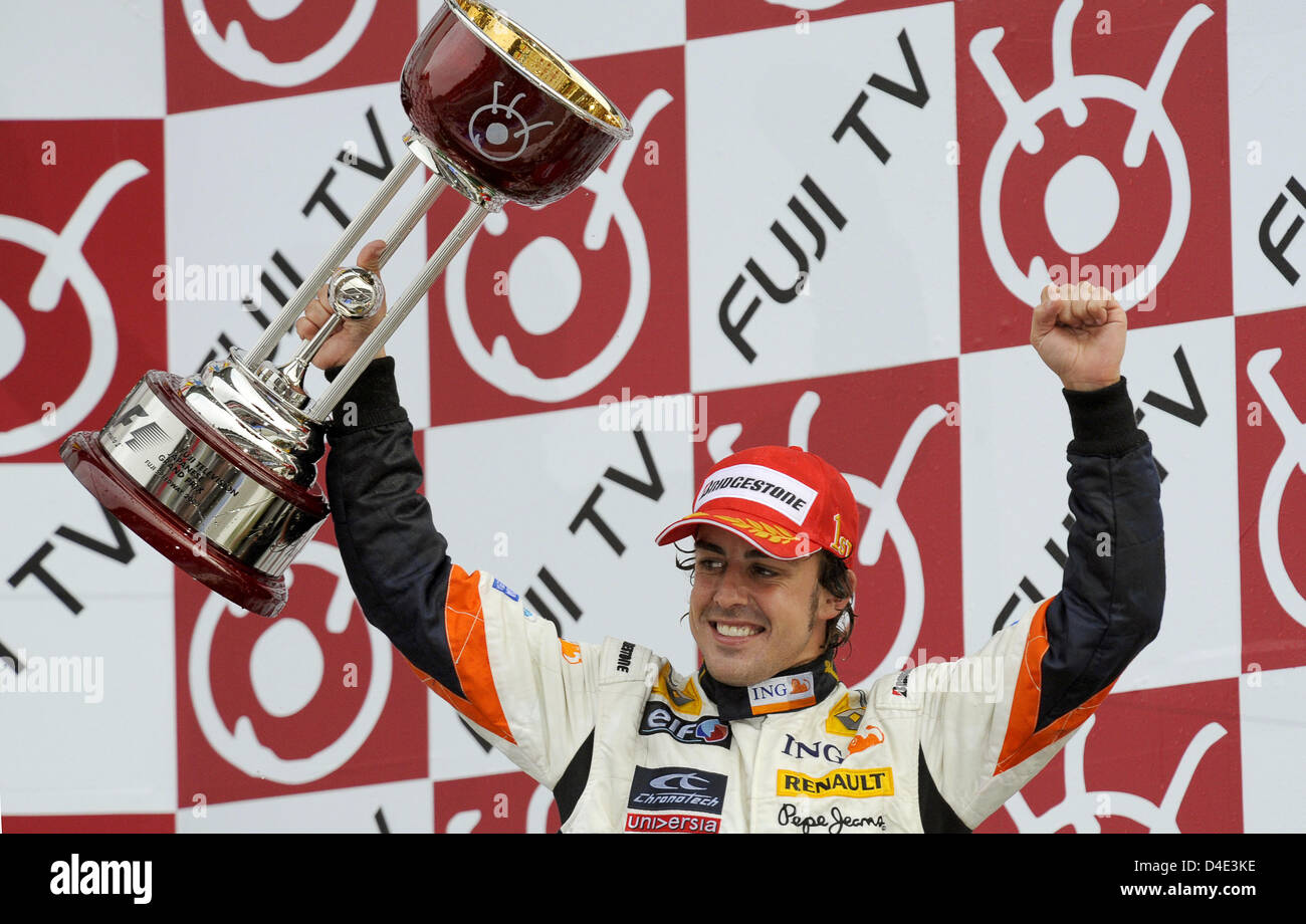 Spanish Formula One driver Fernando Alonso of Renault cheers with his ...
