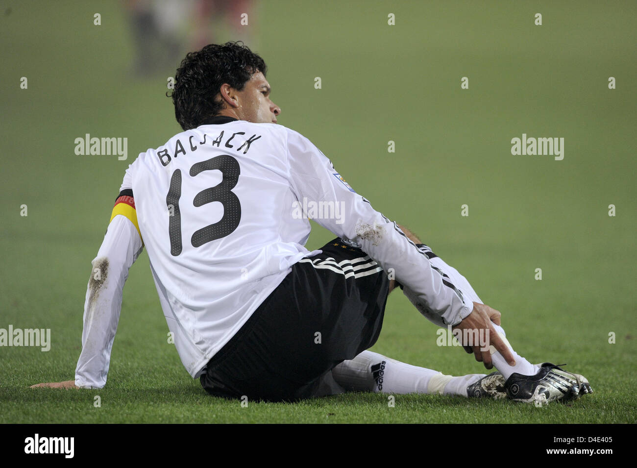 Germany's Michael Ballack sits on the pitch after a foul in the FIFA ...