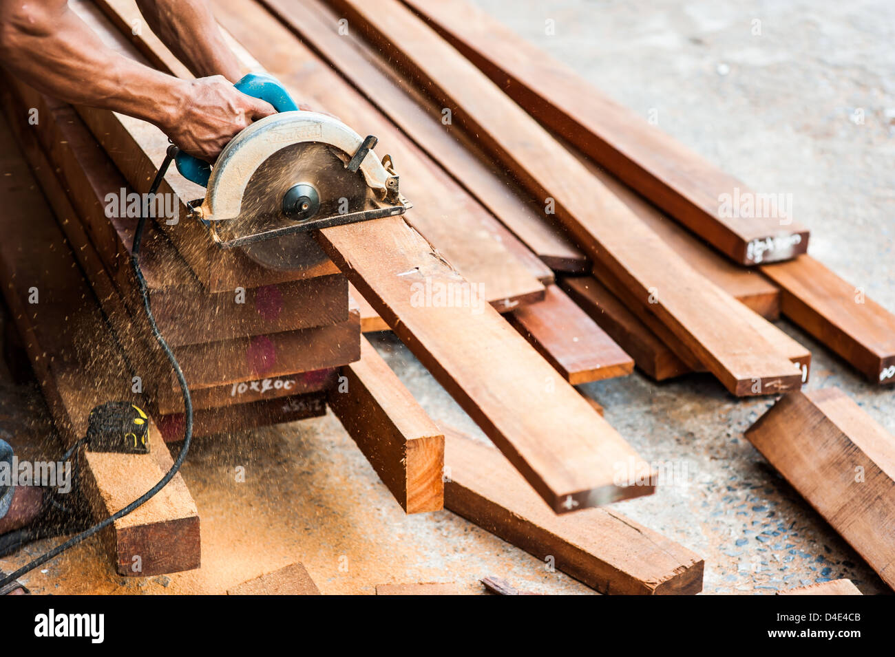 Wood being sawed be electric saw Stock Photo - Alamy