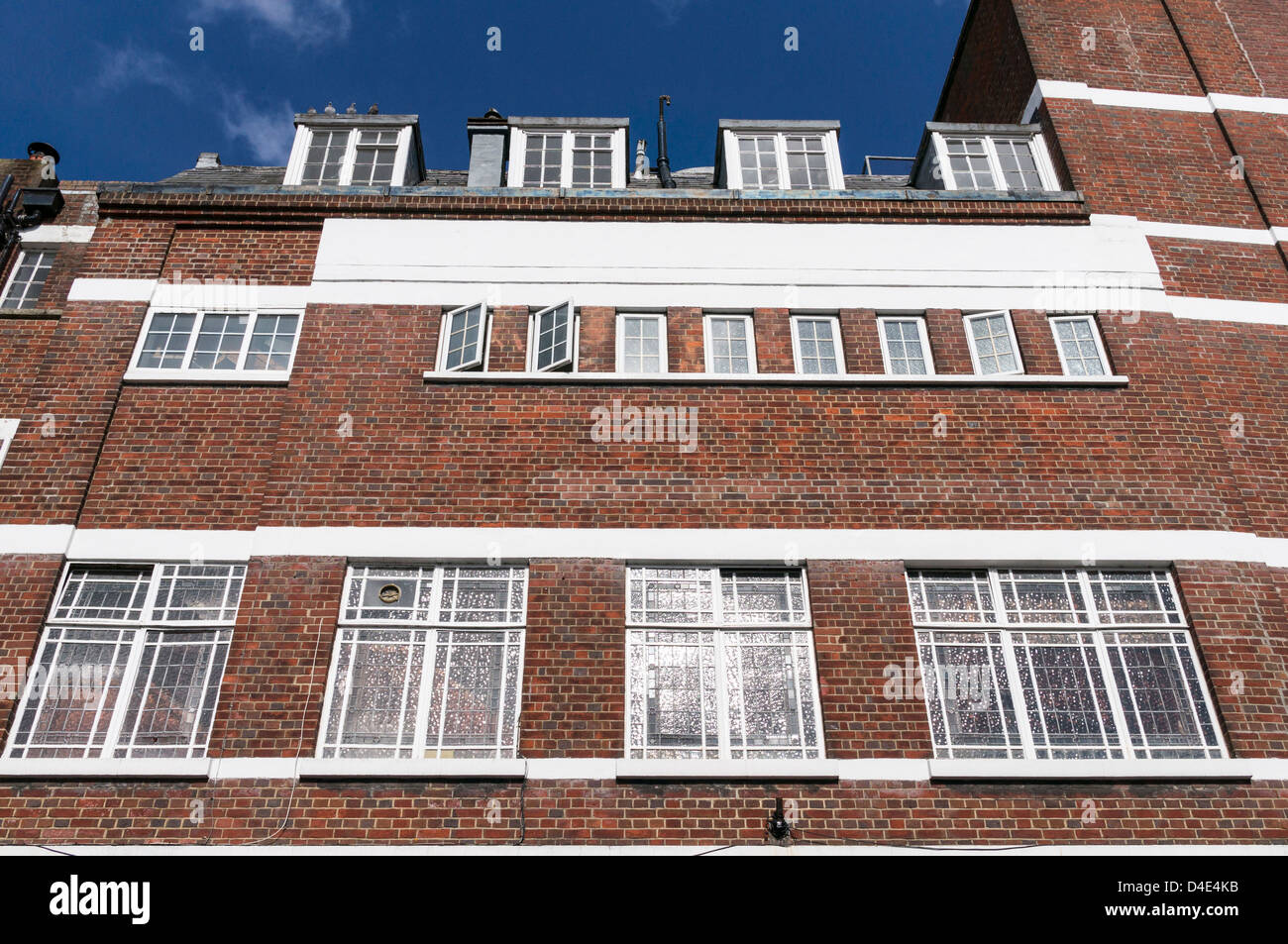Rows if windows set into brick walled building Stock Photo - Alamy