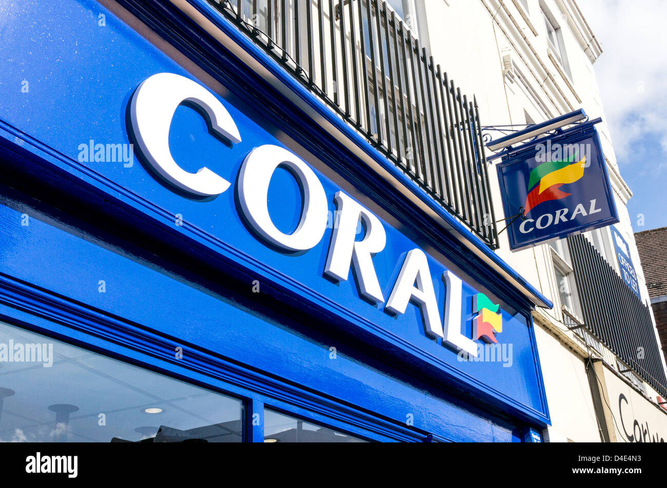 Looking up at Coral betting shop sign and logo Stock Photo - Alamy
