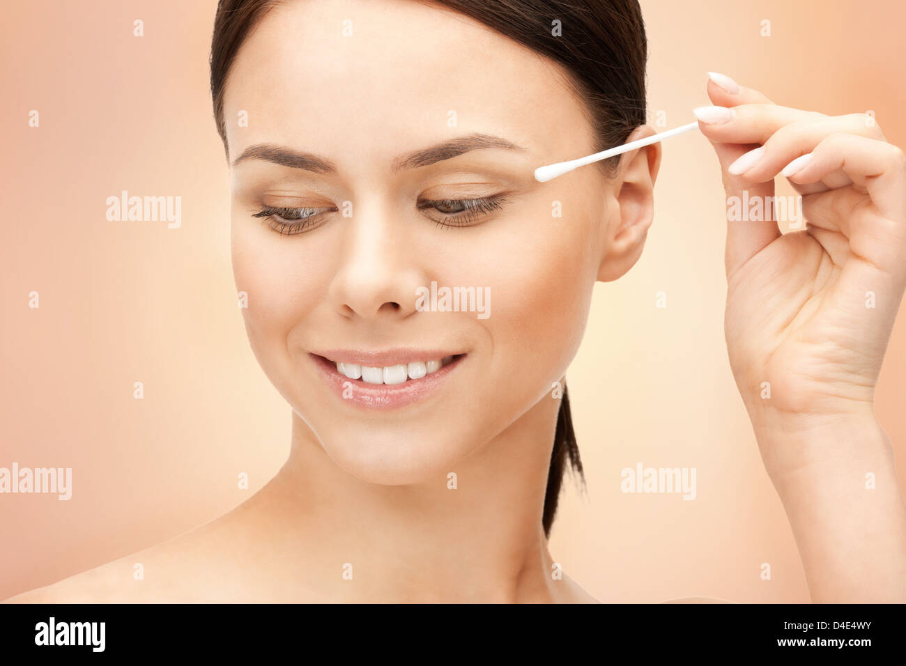 beautiful woman with cotton bud Stock Photo - Alamy