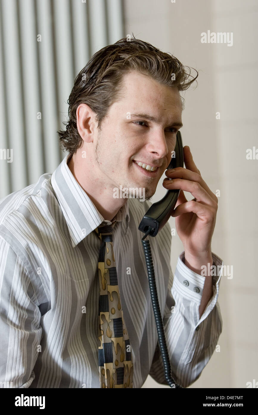 Young man on sales call Stock Photo - Alamy