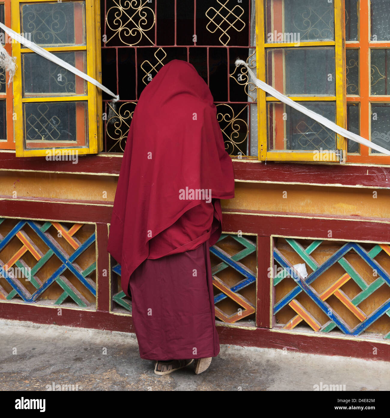 China, Xizang, Lhasa, Drepung Monastery, Woman in traditional outfit ...