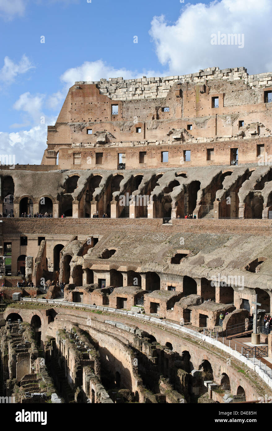 The ruins of the ancient Roman Colosseum at the heart of the Roman ...