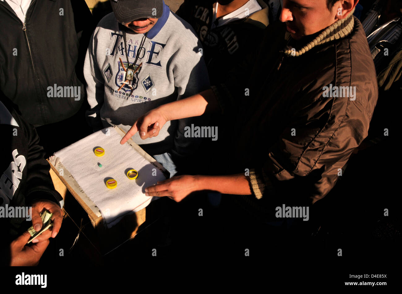 Men gamble on the plaza in Nogales, Sonora, Mexico Stock Photo - Alamy