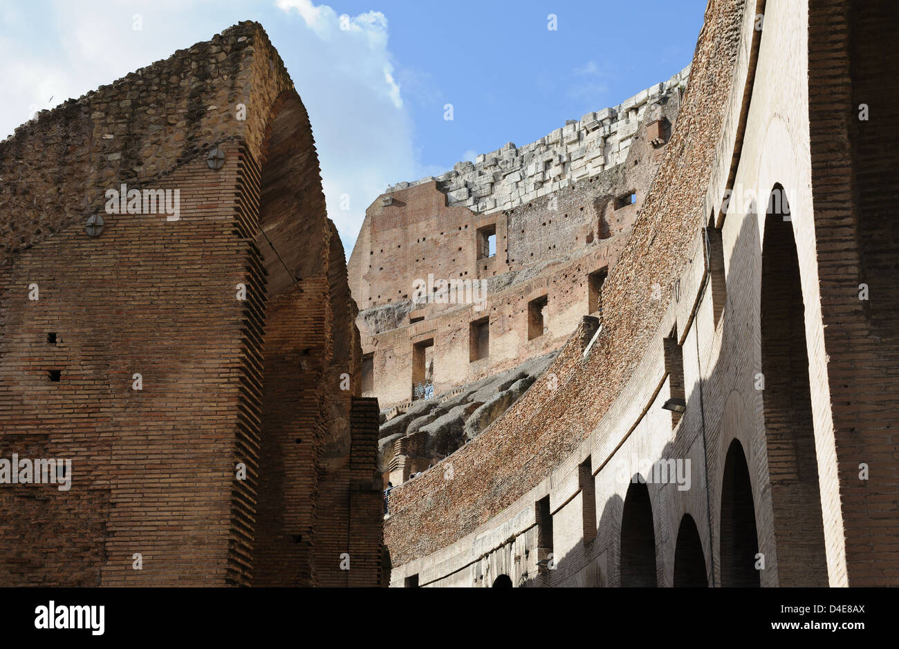 The ruins of the ancient Roman Colosseum at the heart of the Roman ...