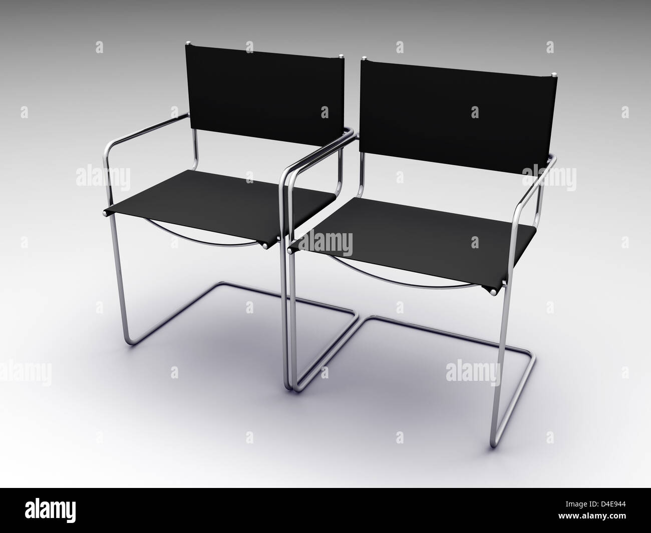 two black chairs on gray background Stock Photo - Alamy