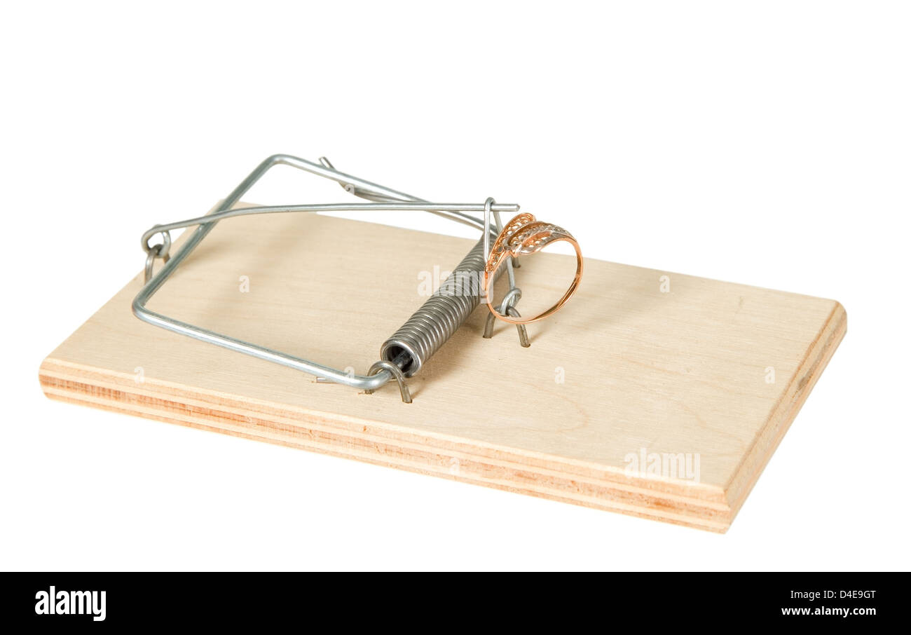 A mouse trap with golden ring on it Stock Photo - Alamy