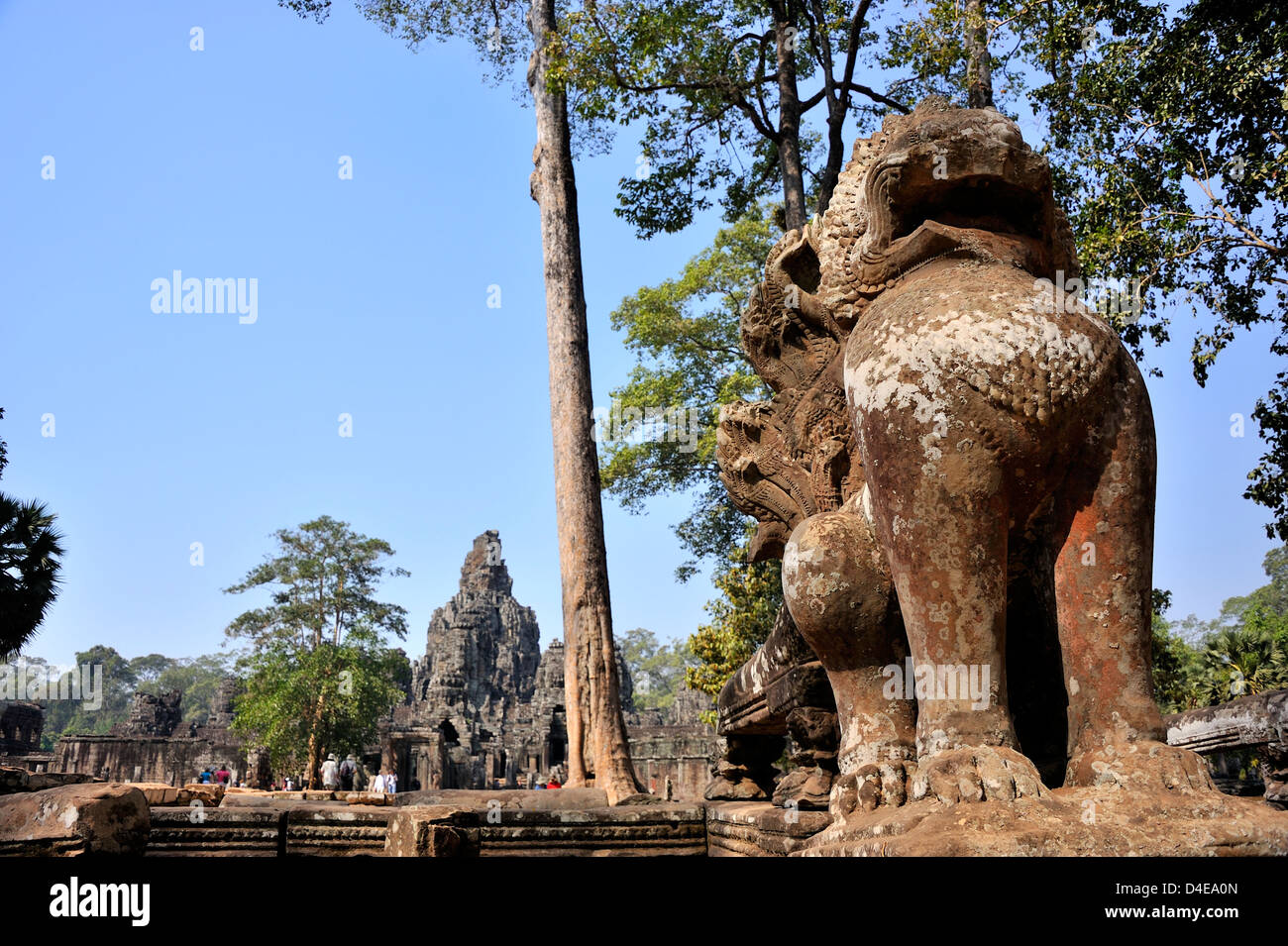 Guardian Lion at the entrance to Bayon temple in The Angkor Complex ...