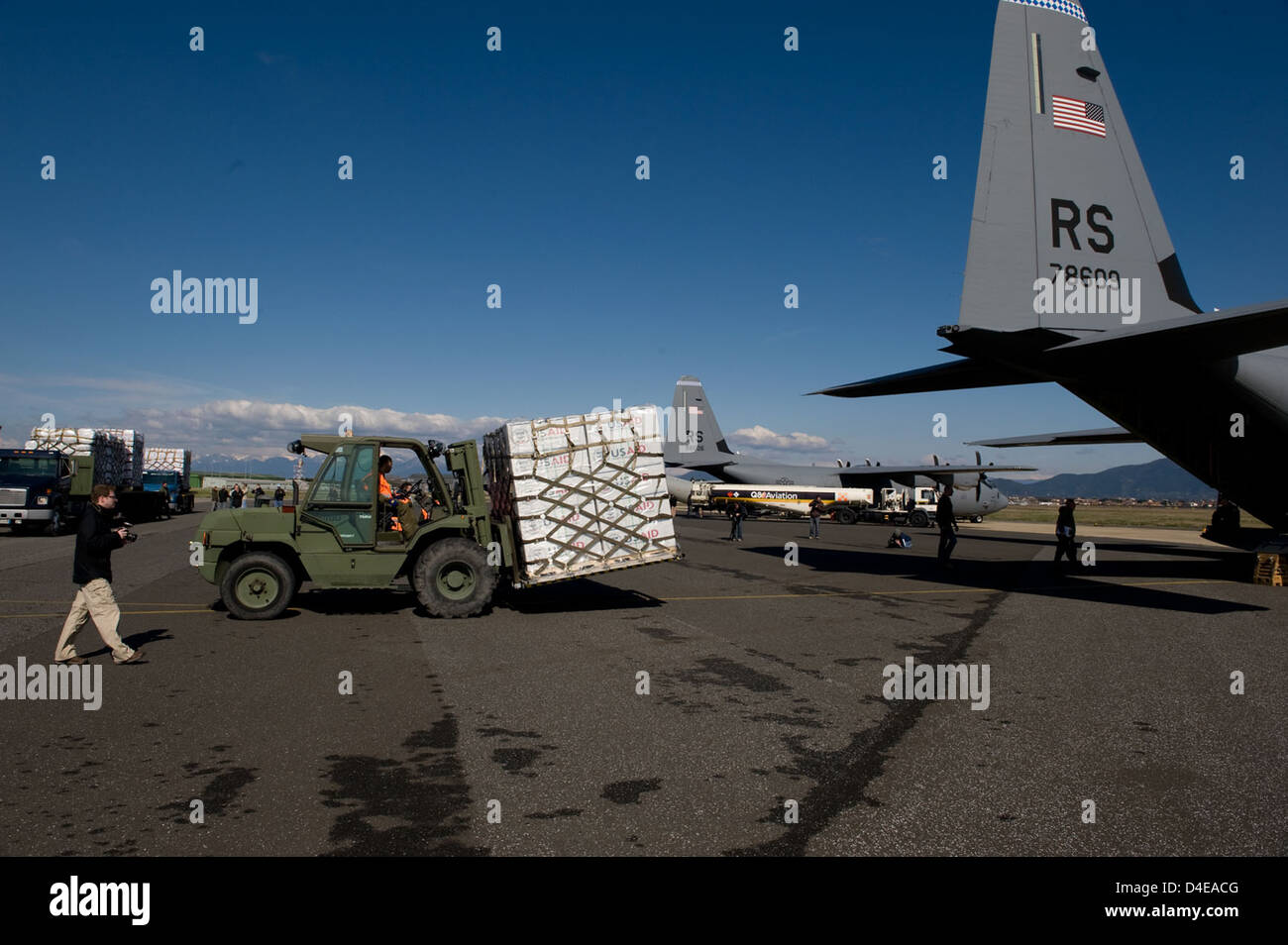 U.S. Airmen Load Blankets, Tarps, and Water Containers Onto Aircraft ...