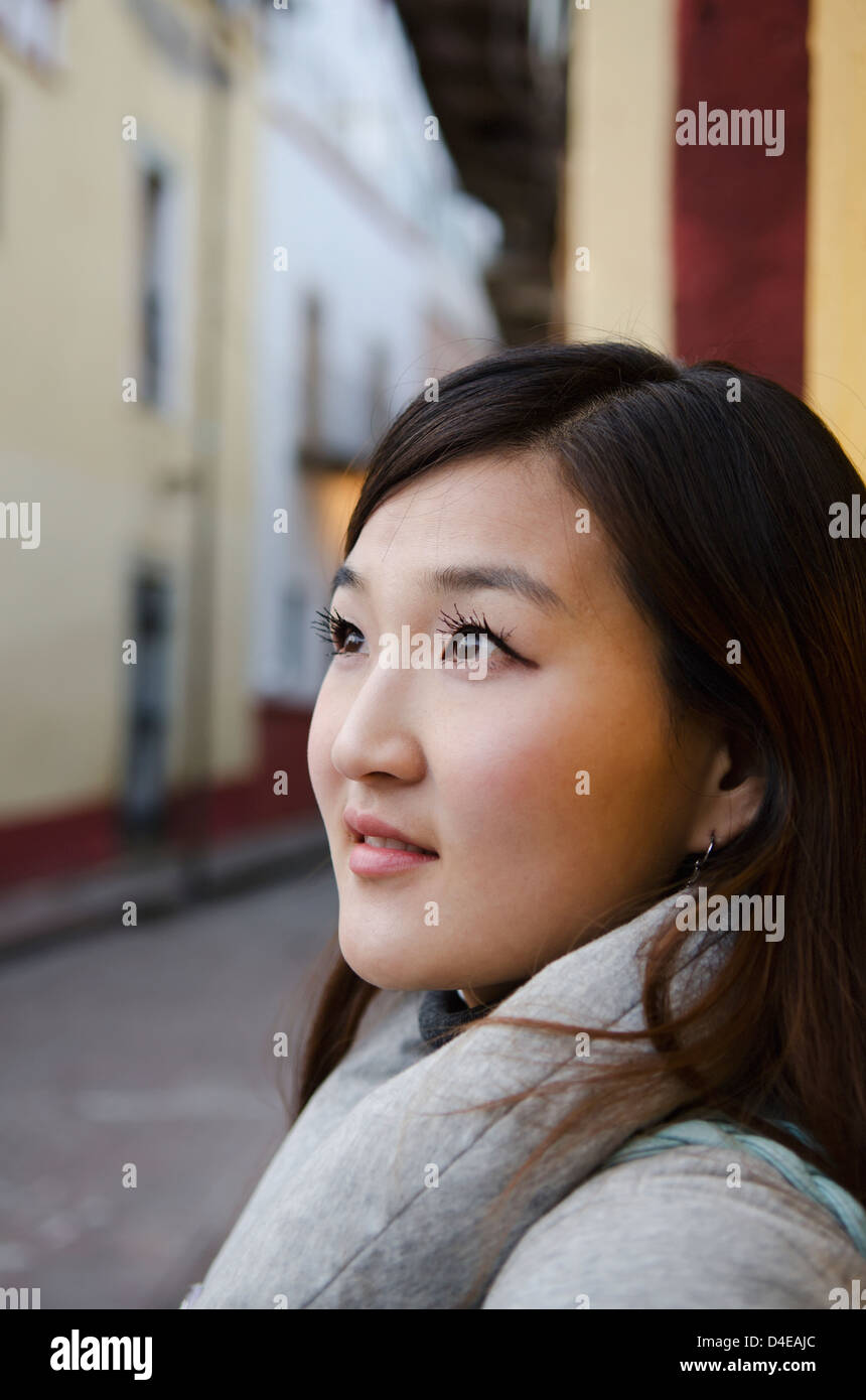 Young Korean woman with old Spanish buildings in background; Guanajuato ...