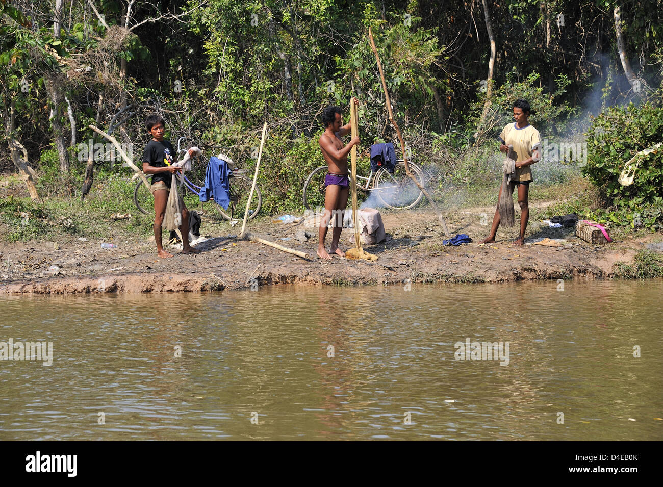 Young men fishing hi-res stock photography and images - Alamy