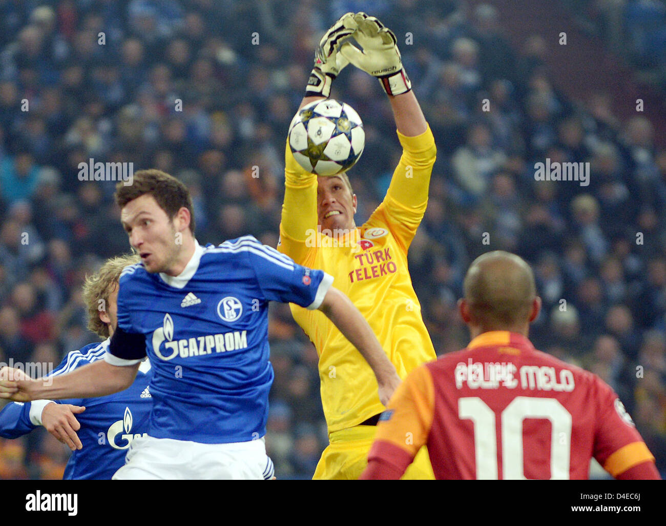Gelsenkirchen, Germany. 12th March 2013. Schalke's Marco Hoeger (L) and ...