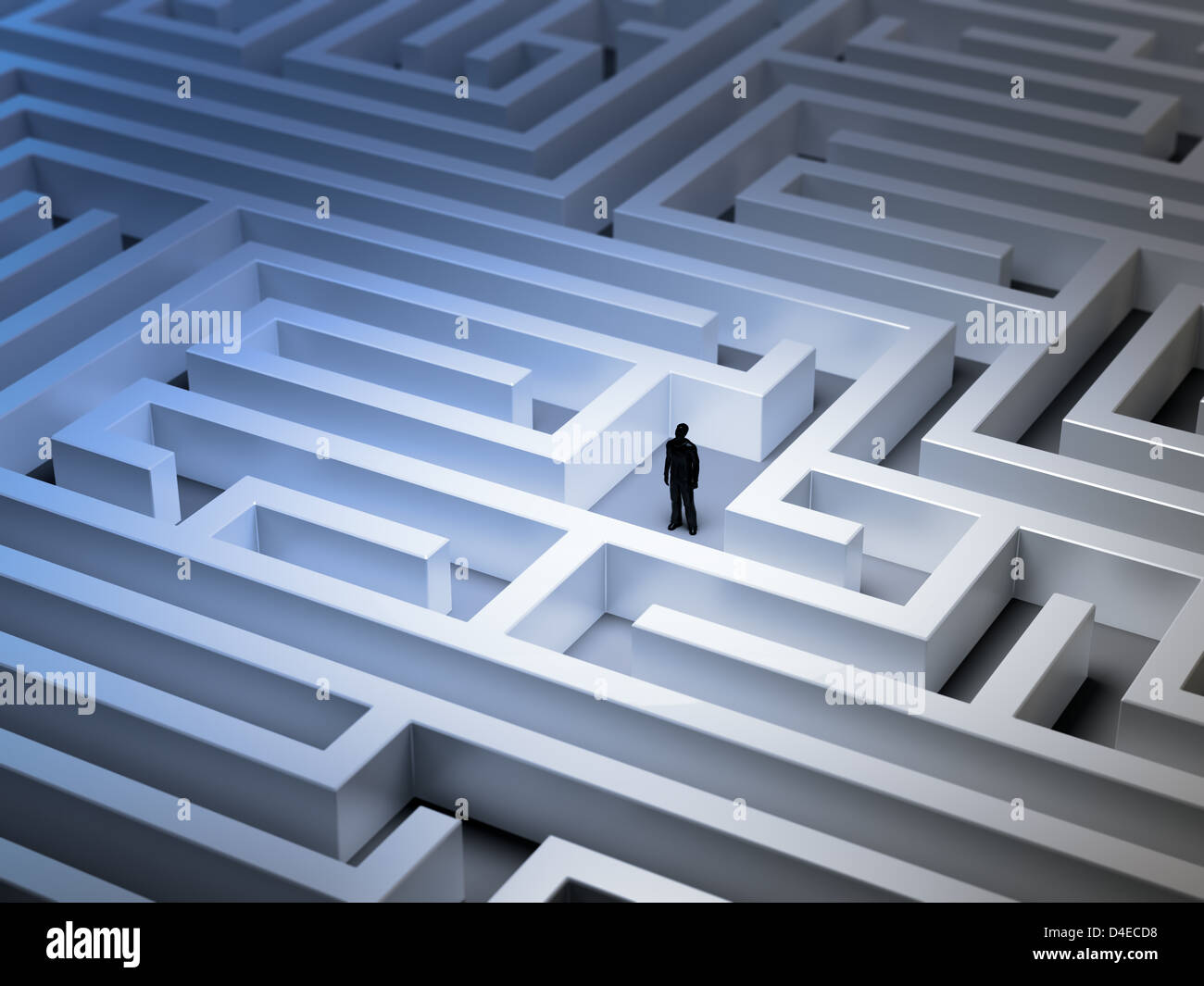 Tiny man in an endless maze Stock Photo - Alamy