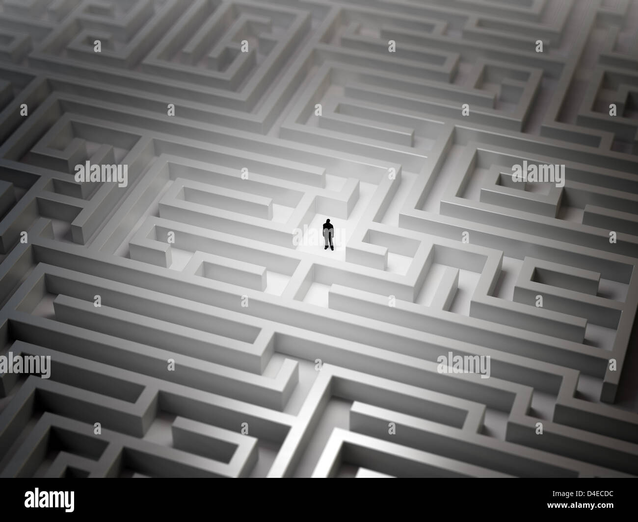 Tiny man in an endless maze Stock Photo - Alamy