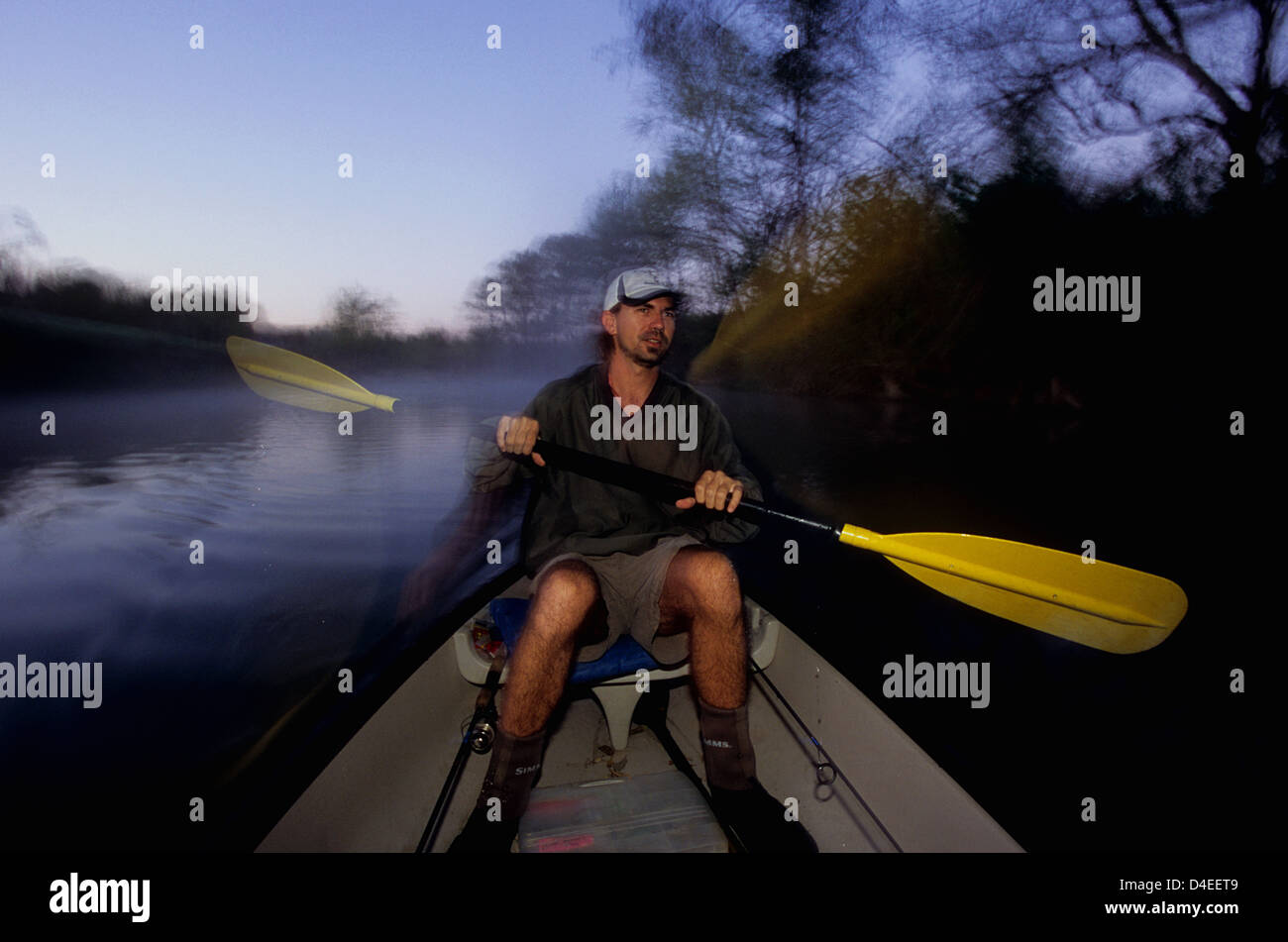 Man paddling a canoe on the Blanco River Texas Stock Photo - Alamy