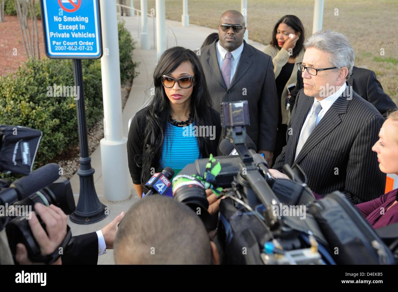 Mckinney, Texas, USA. 12th March 2013. Pilar Sanders, flanked by her ...