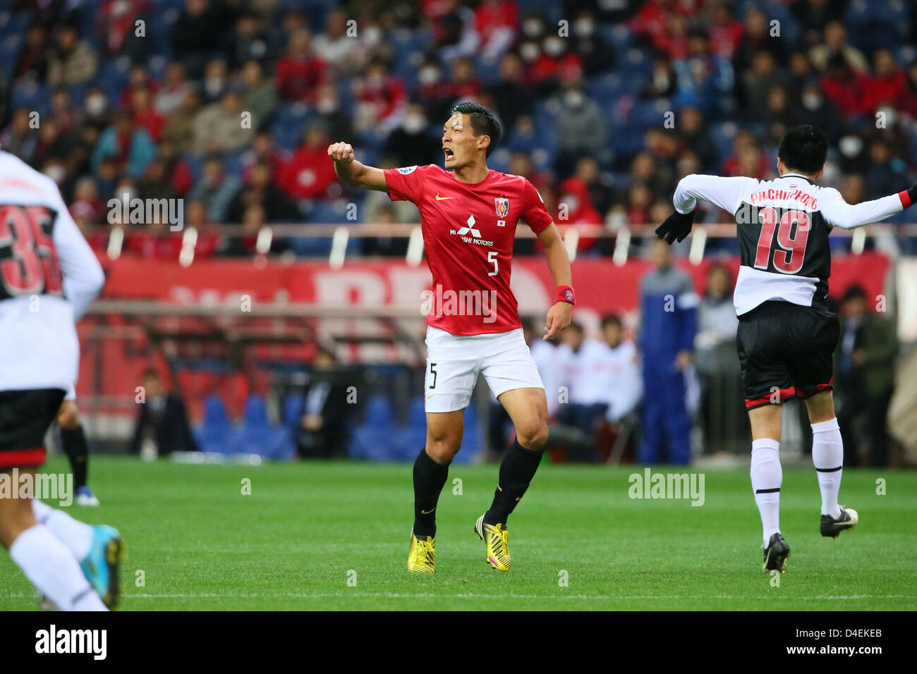 Saitama, Japan. 12th March 2013. Tomoaki Makino (Reds), MARCH 12, 2013 ...