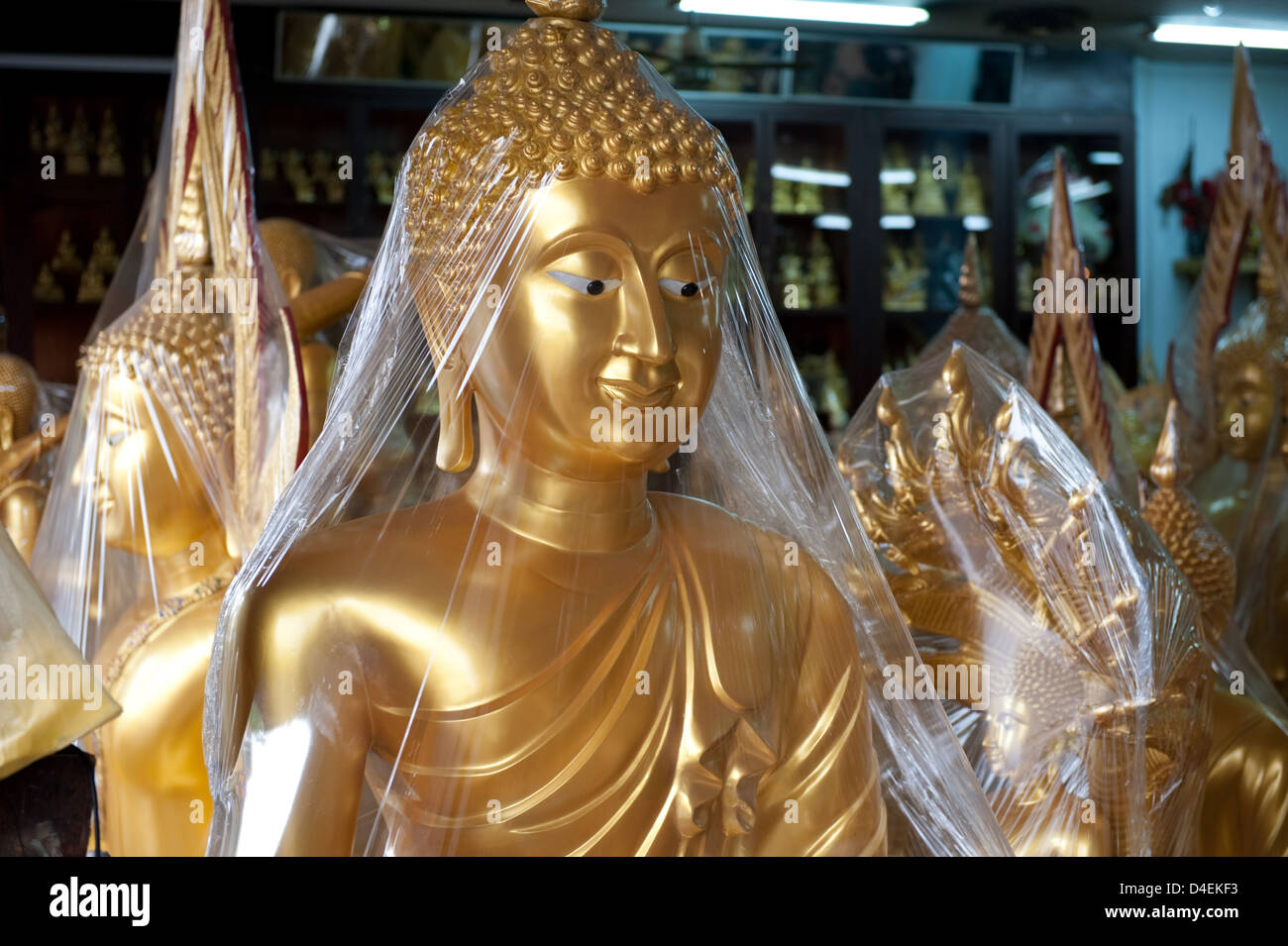 Bangkok, Thailand, packaged in plastic Buddha statue Stock Photo - Alamy