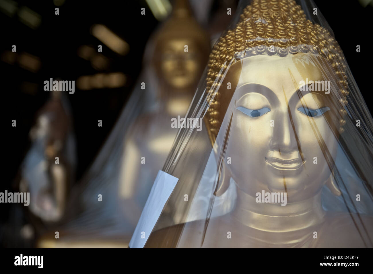 Bangkok, Thailand, packaged in plastic Buddha statue Stock Photo - Alamy