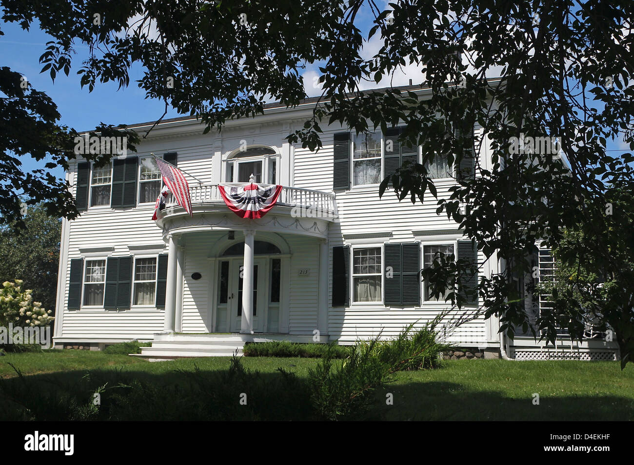 A stately home framed by shade trees in Thomaston, Maine Stock Photo ...