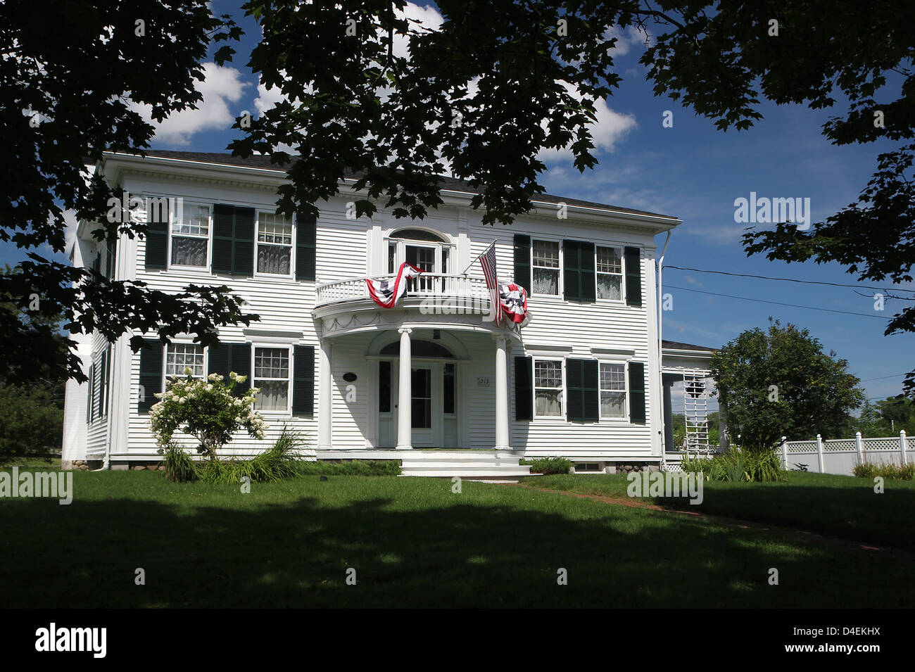 A stately home framed by shade trees in Thomaston, Maine Stock Photo ...