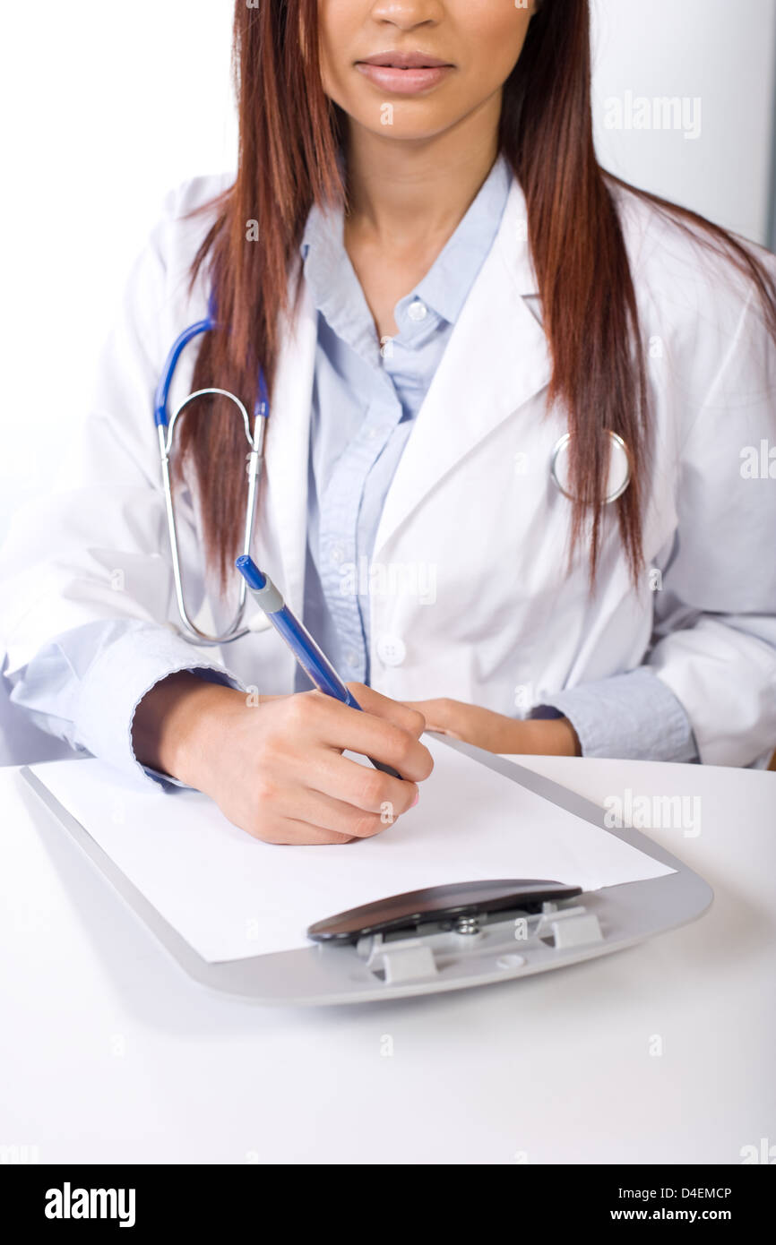 Woman doctor holding a chart in a modern office Stock Photo - Alamy