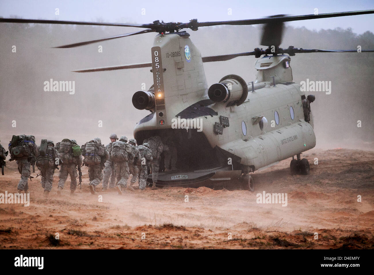 US Army Scout teams board a Chinook helicopter during training March 5 ...