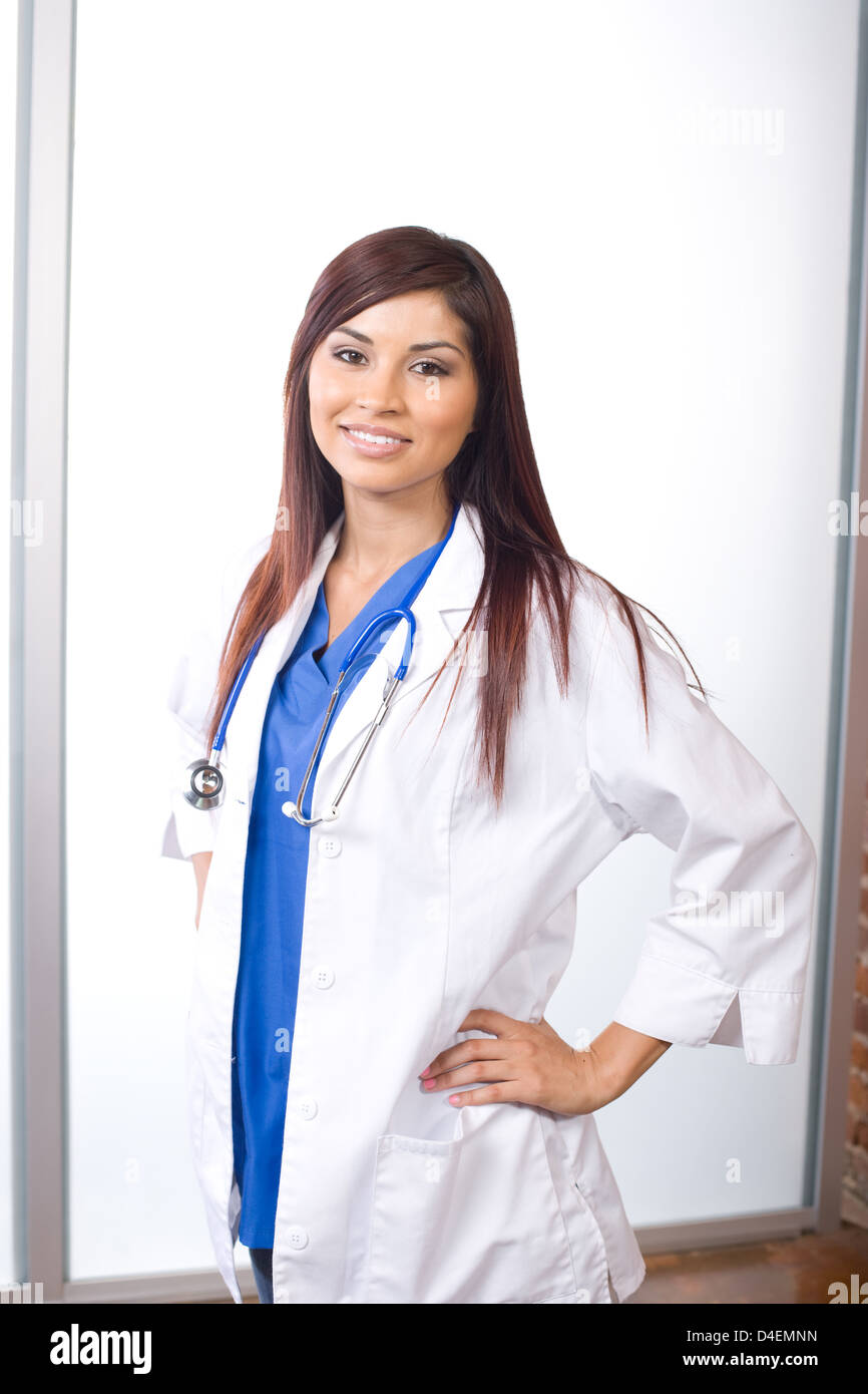 Young female doctor standing in a modern office Stock Photo - Alamy