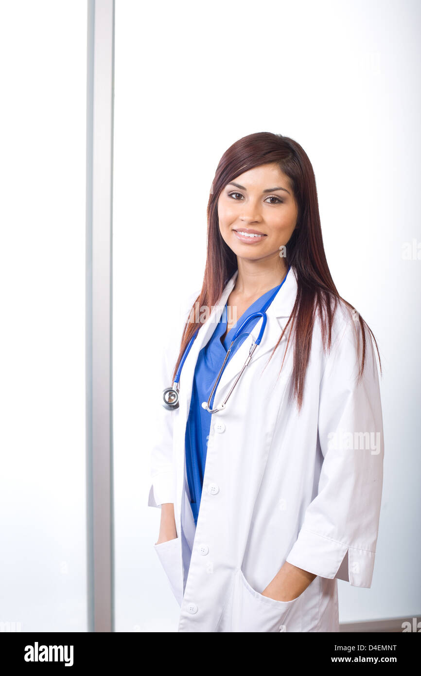 Young female doctor standing in a modern office Stock Photo - Alamy