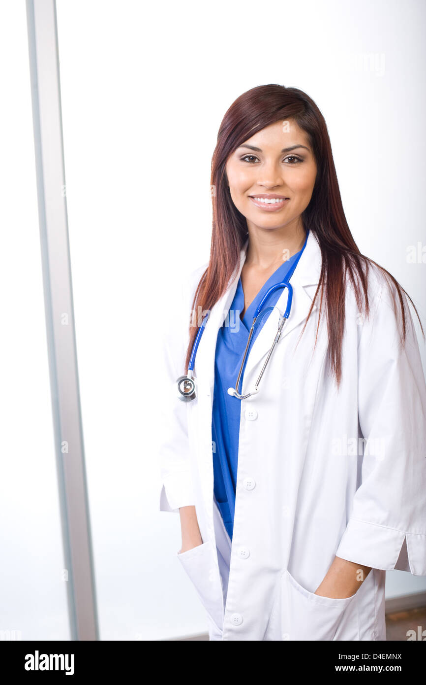 Young female doctor standing in a modern office Stock Photo - Alamy