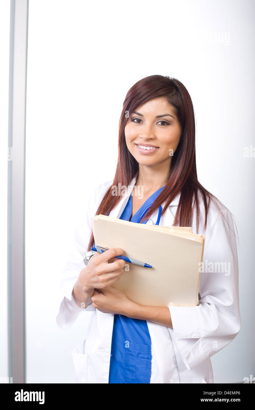 Woman doctor holding a chart in a modern office Stock Photo - Alamy