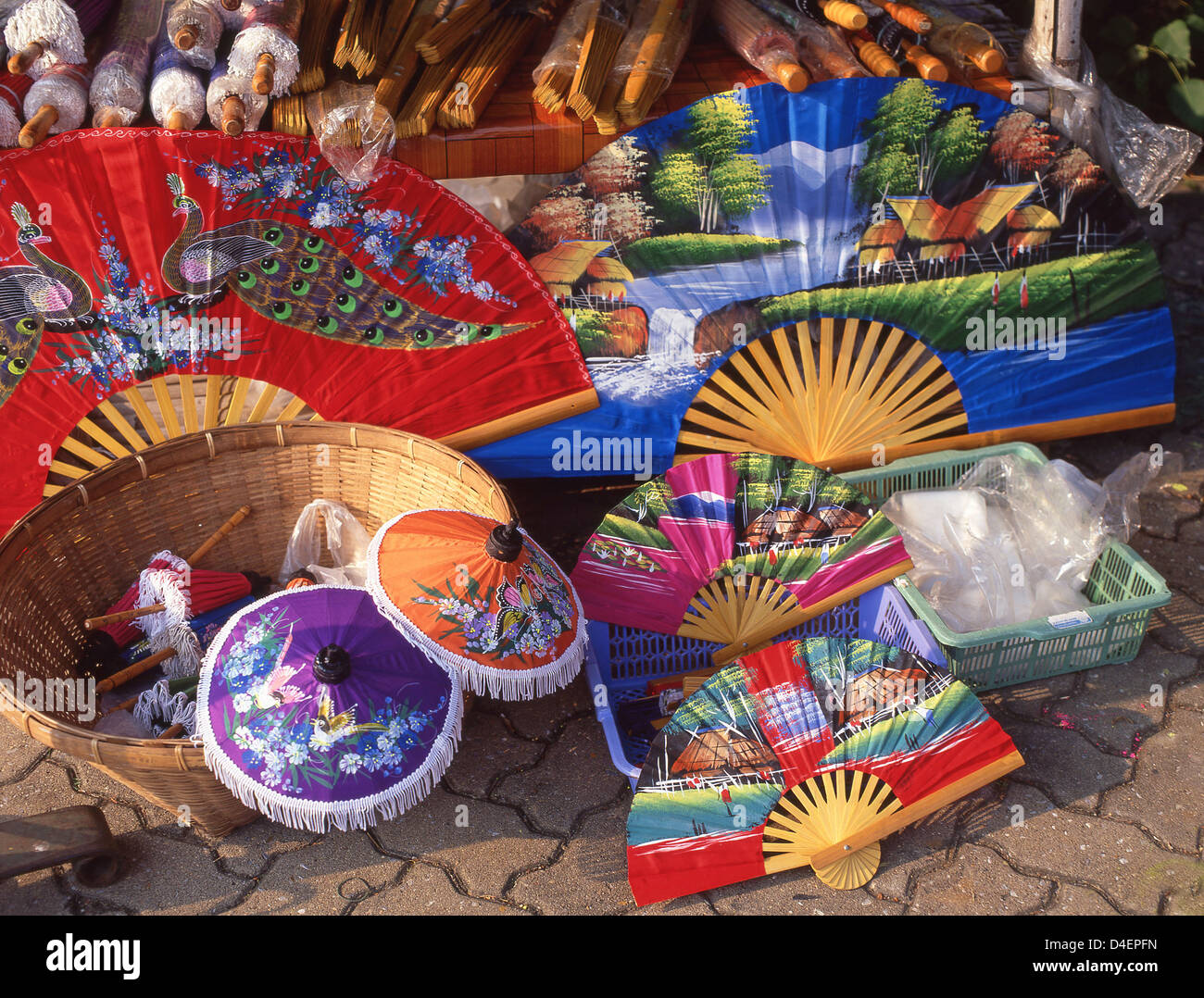 Colourful souvenir fan and parasol display in New Phetchaburi Road ...