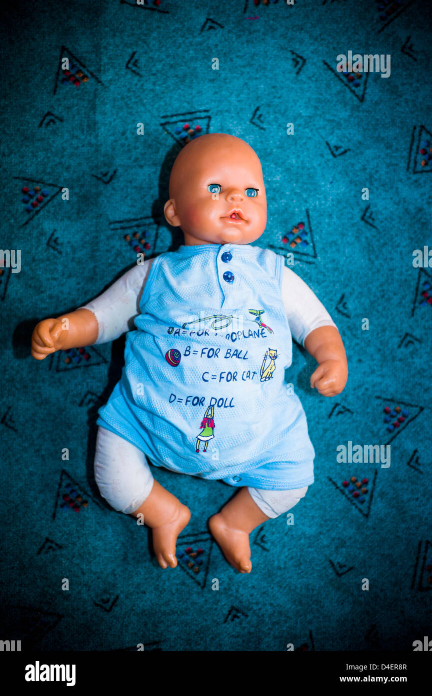 doll lying on the floor Stock Photo - Alamy